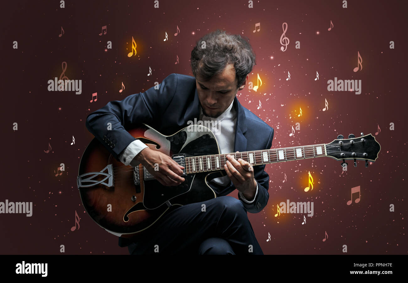 Young guitarist with falling musical notes wallpaper and classical ...