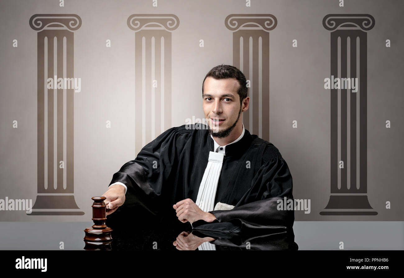 Young judge in front of a courthouse symbol making decision Stock Photo ...