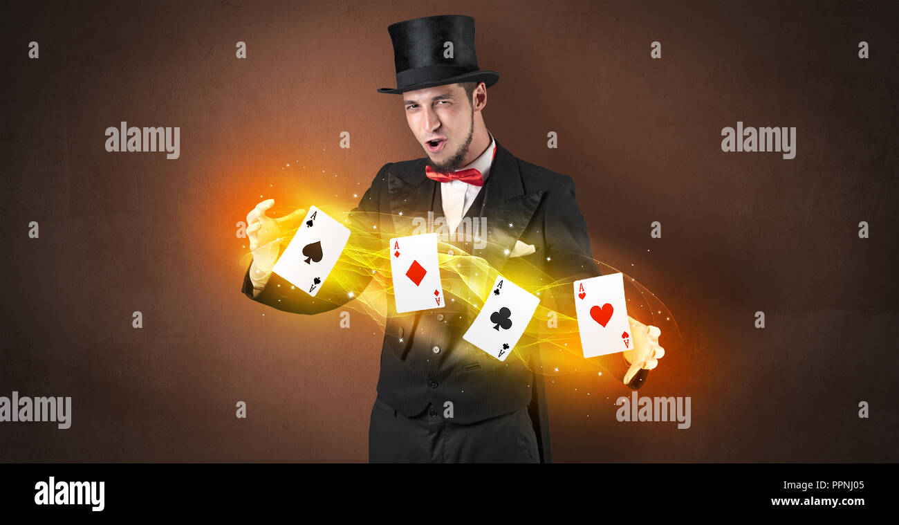 Illusionist in tails bandy play cards between his two hands Stock Photo ...