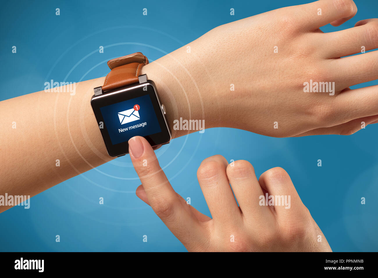 Female hand receives new message on her smartwatch Stock Photo - Alamy
