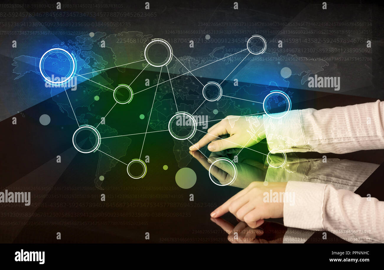 Male hands touching interactive table with colorful world map on it ...