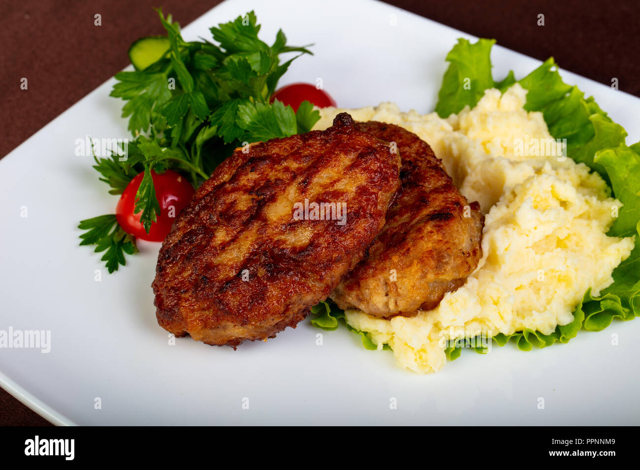 Minced meat cutlet with mashed potato Stock Photo - Alamy