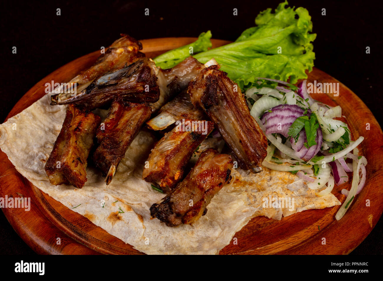 Grilled Mutton ribs with onion Stock Photo - Alamy