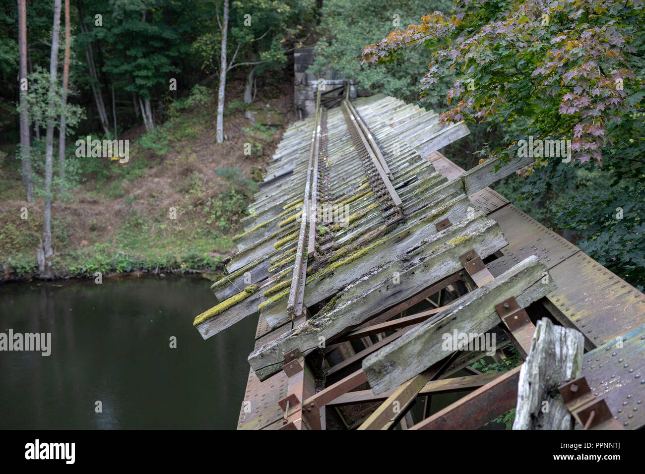 Old destroyed railway bridge over the river. Railway crossing blown up ...