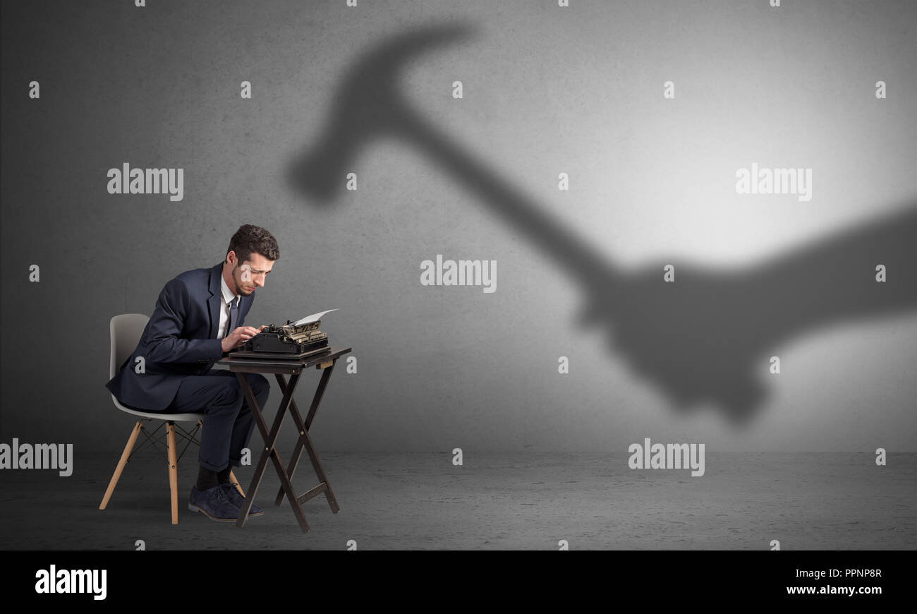 Shadow threatening hard worker man who is afraid Stock Photo - Alamy