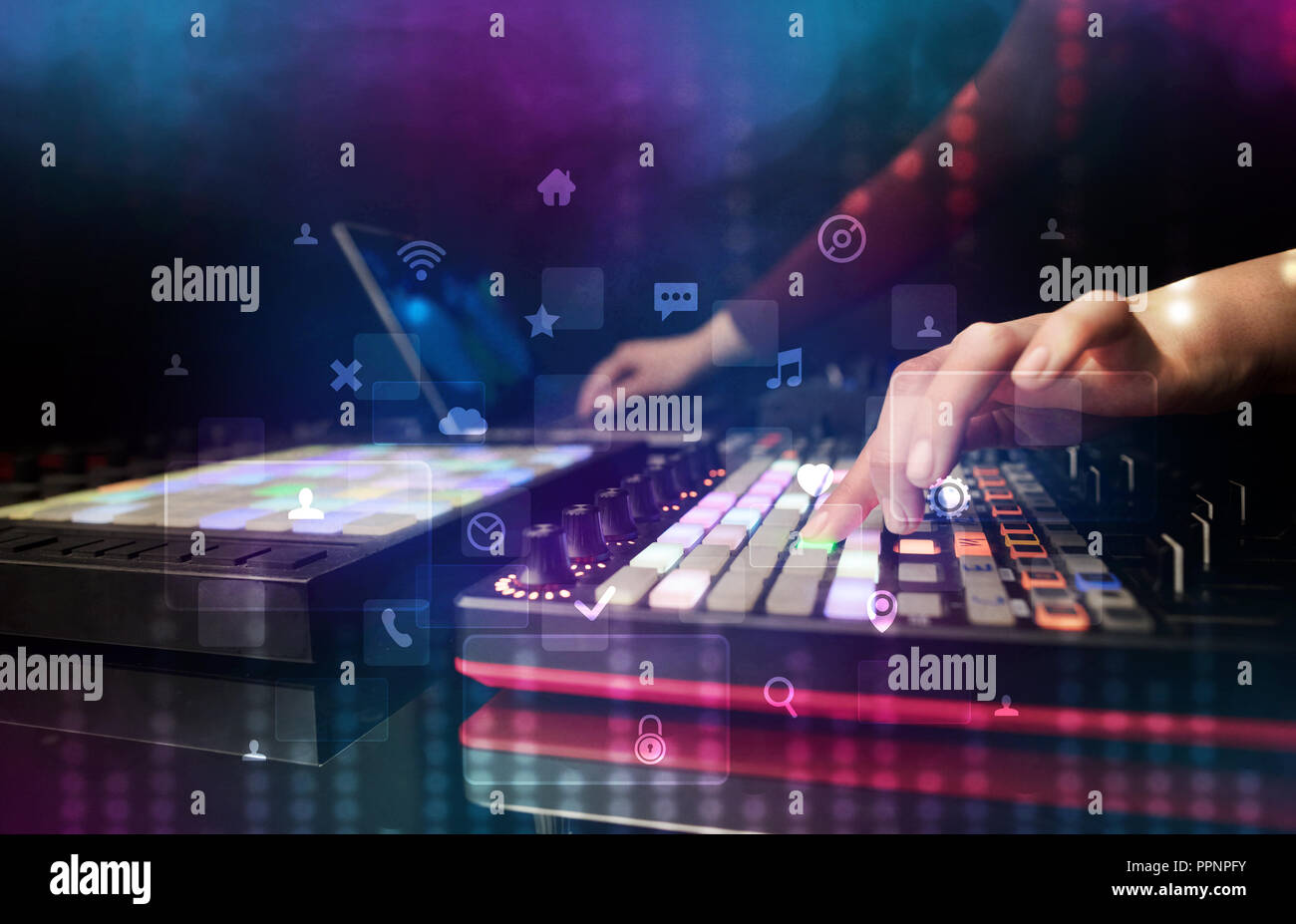 Hand mixing music on dj controller with social media concept icons ...