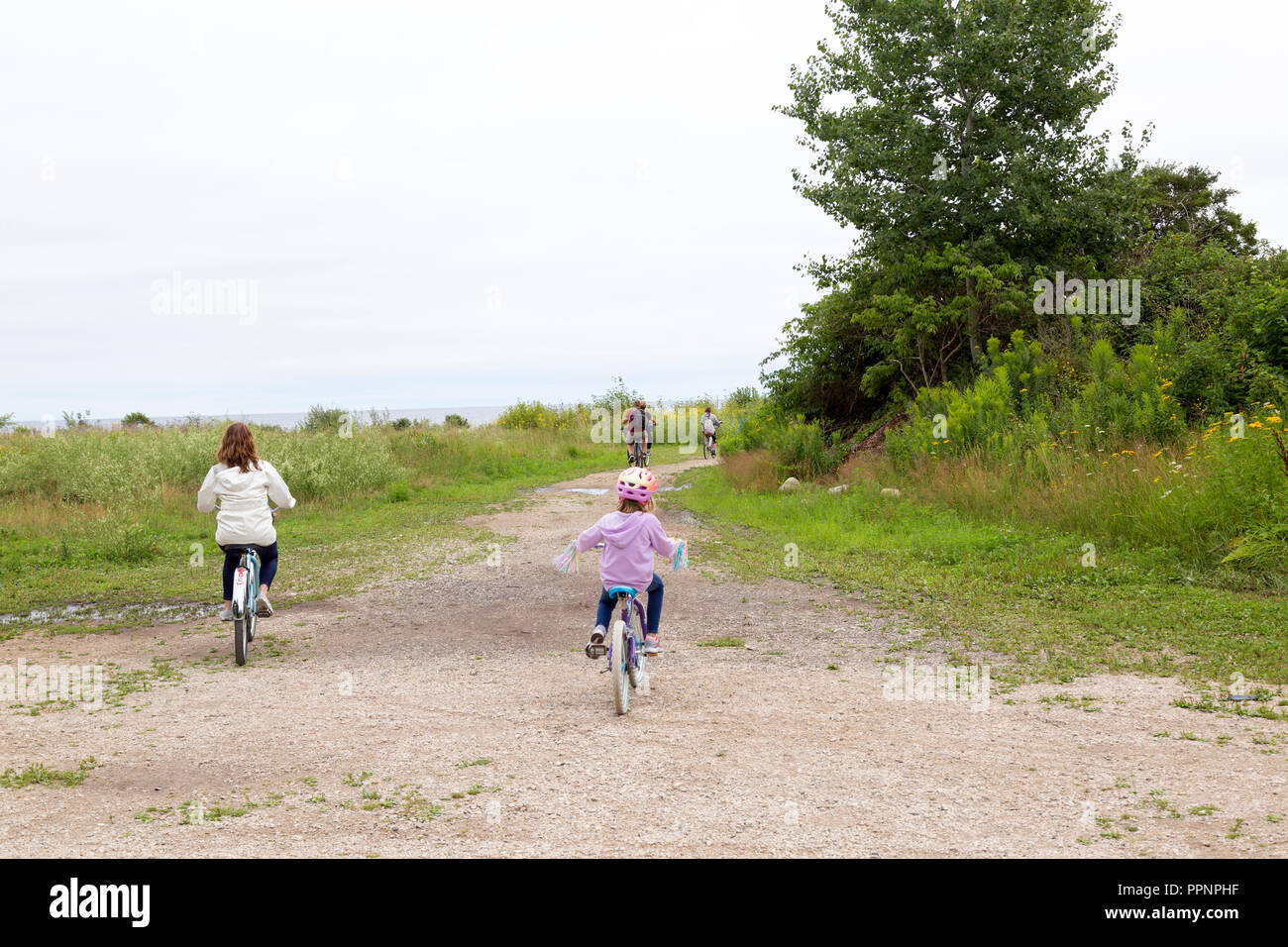 Family riding bikes hi-res stock photography and images - Alamy