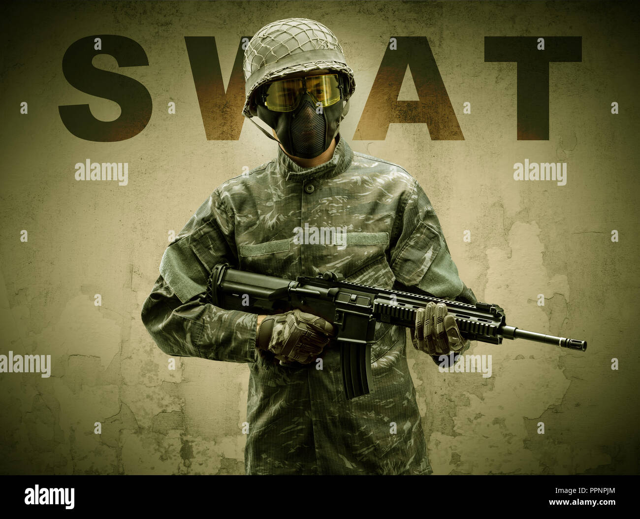 Uniformed armed soldier with damaged wall background Stock Photo - Alamy