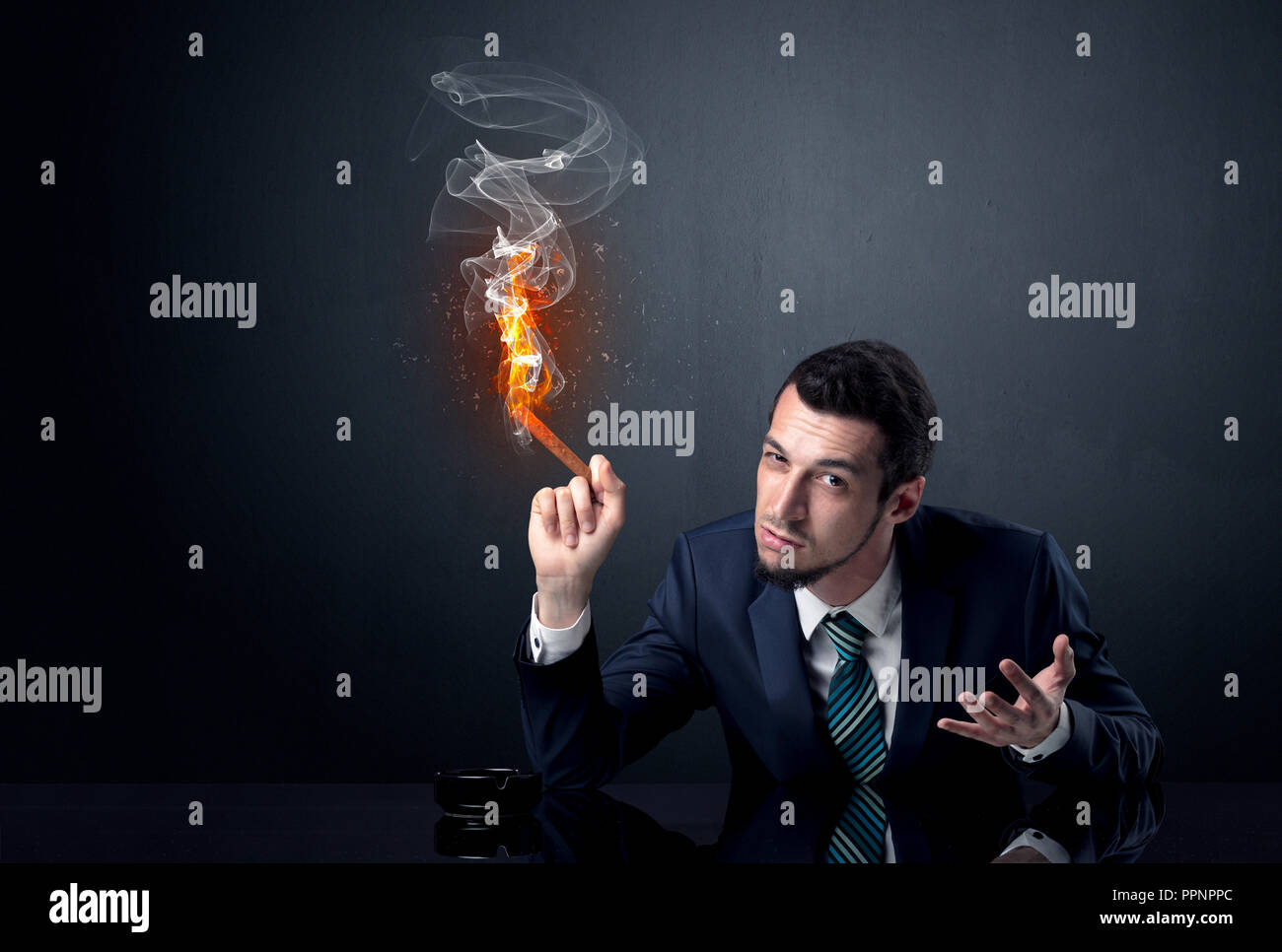 Businessman smoking with inferno effect Stock Photo - Alamy