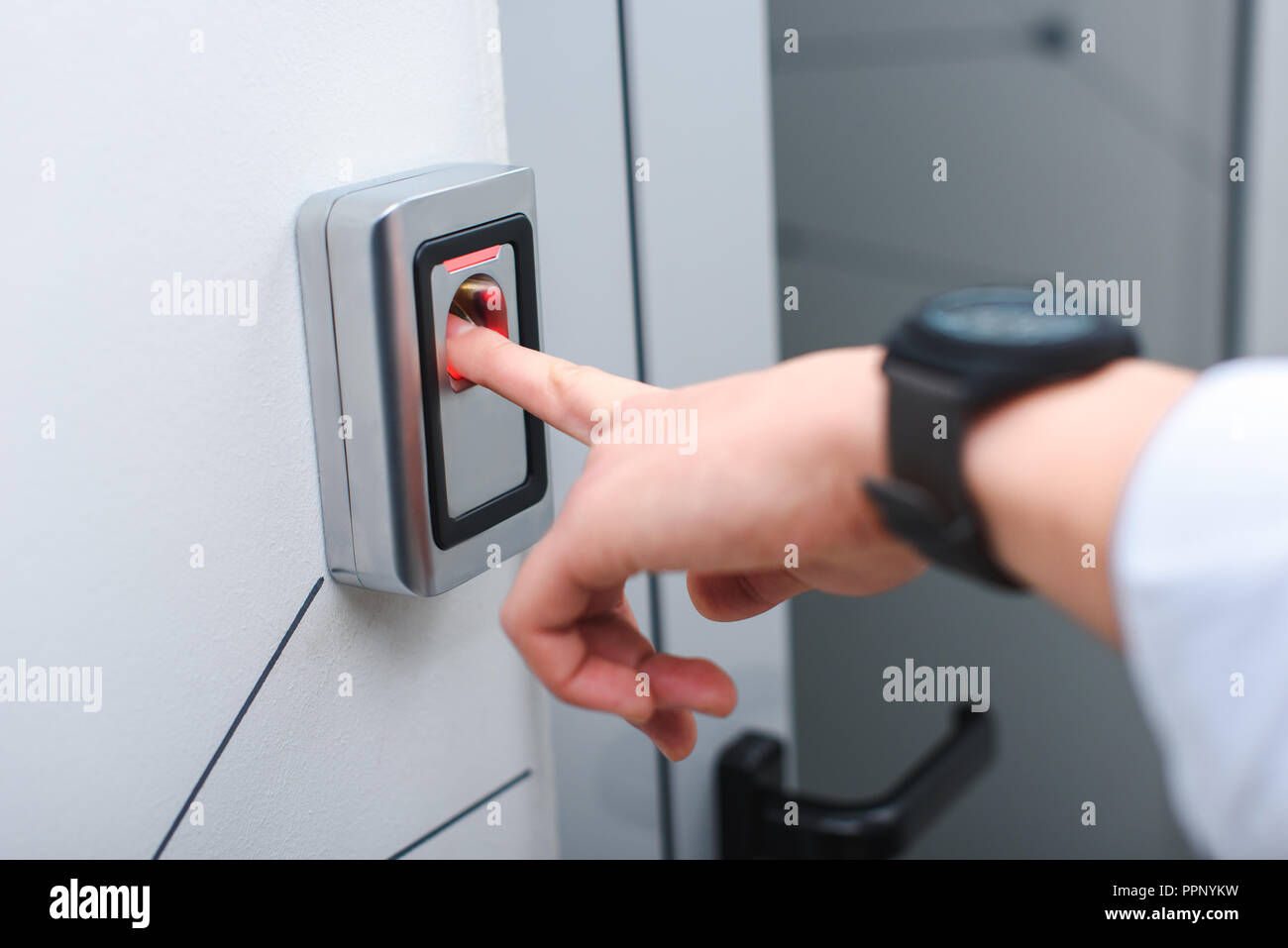cropped image of man with wristwatch pushing button of elevator Stock ...