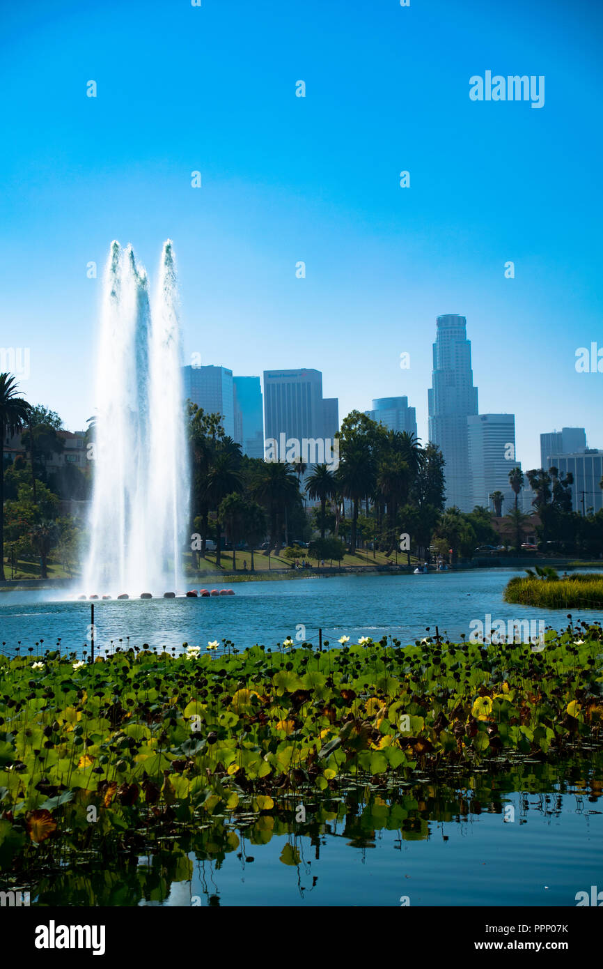 Fountain on Echo Park Lake with the Los Angeles skyline in the ...