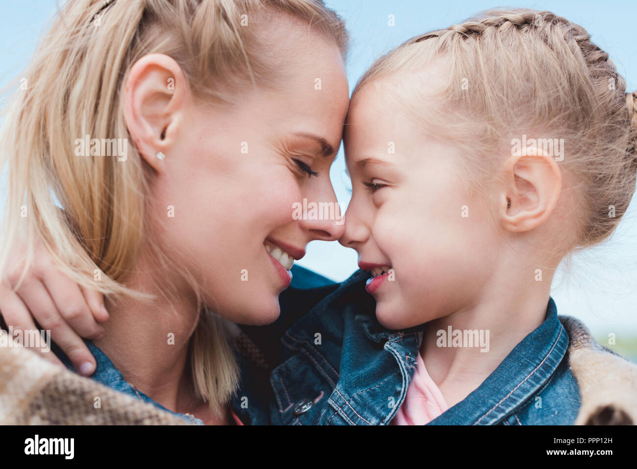 beautiful mother and happy daughter touching noses Stock Photo - Alamy