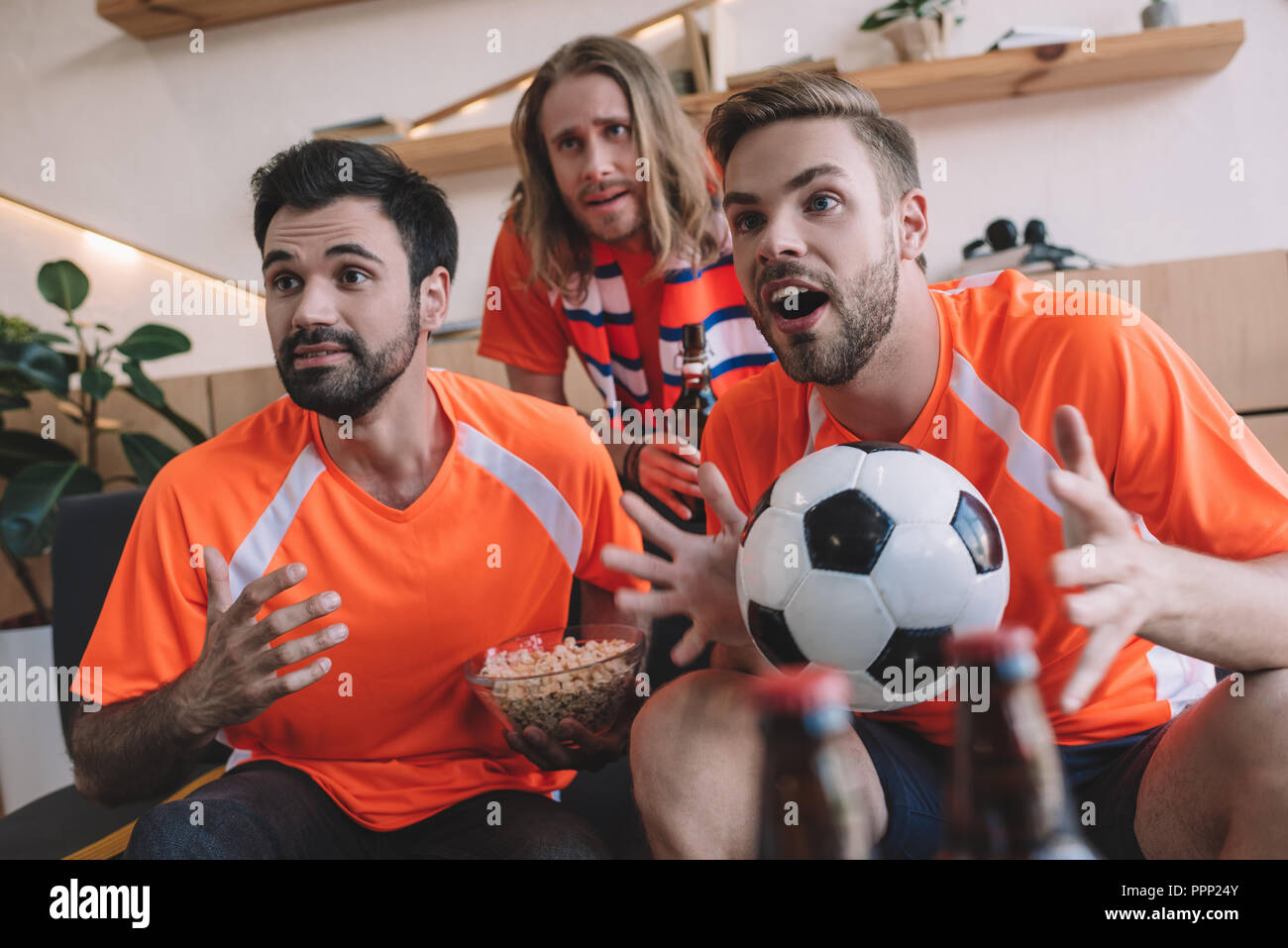 Young football fans world cup watching hi-res stock photography and ...