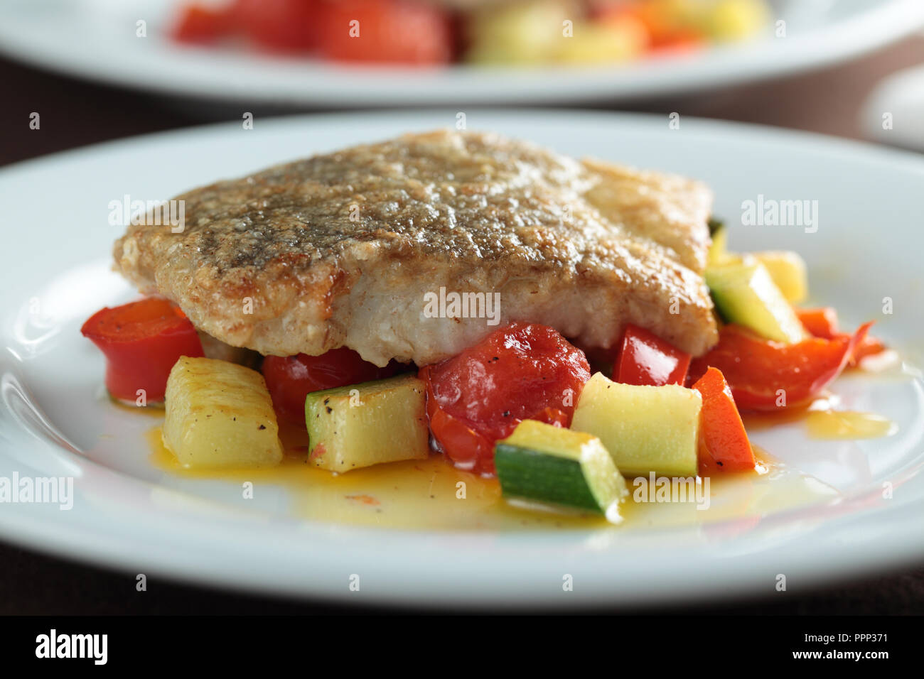 Roasted pollock fillet with vegetables Stock Photo - Alamy