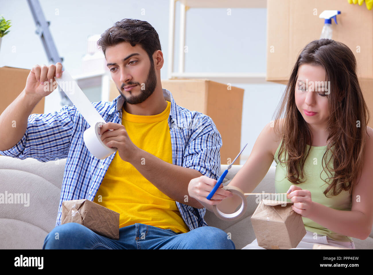 Family preparing for christmas after relocation Stock Photo - Alamy