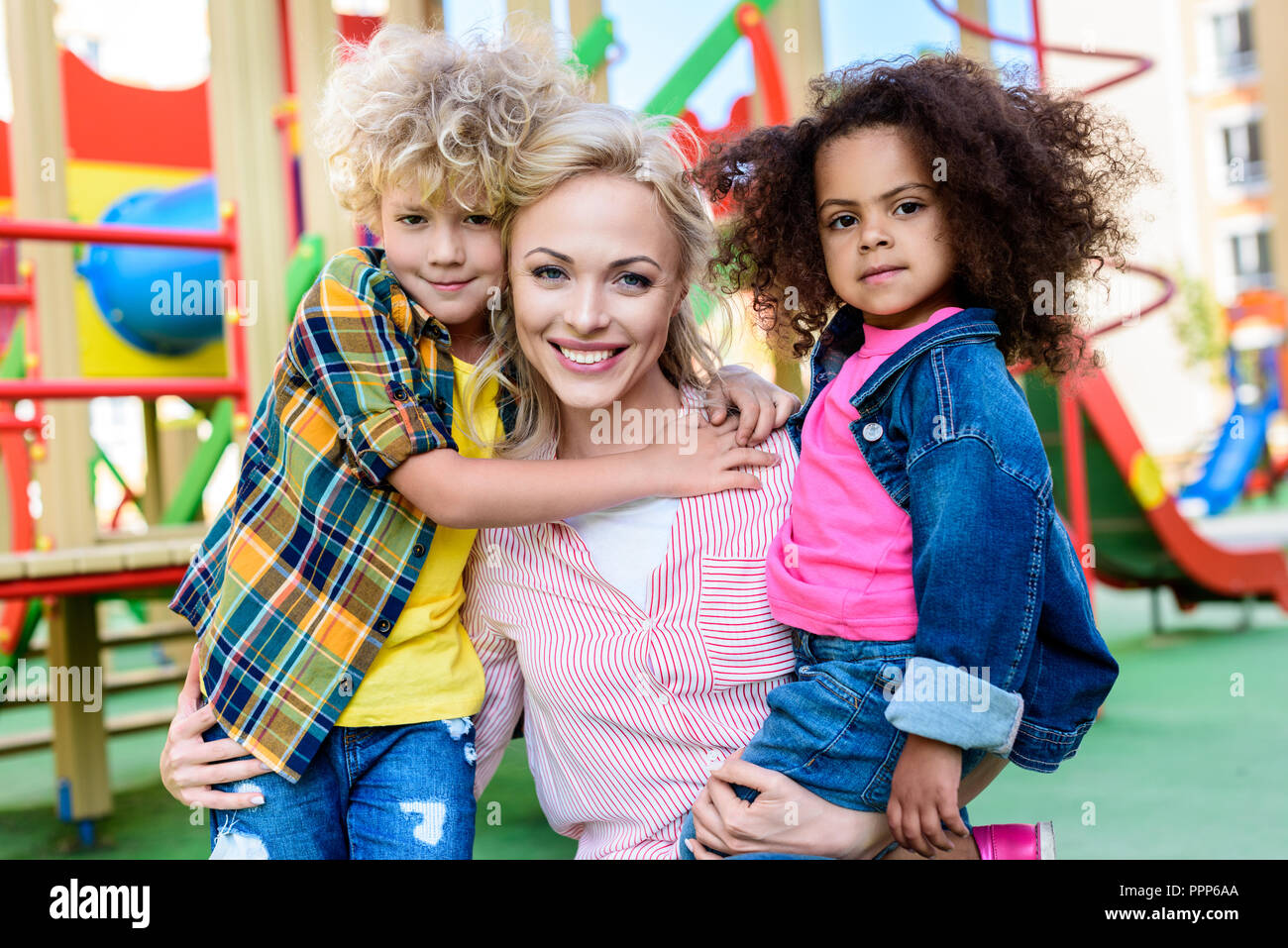 selective focus of little african american child with friend and his ...