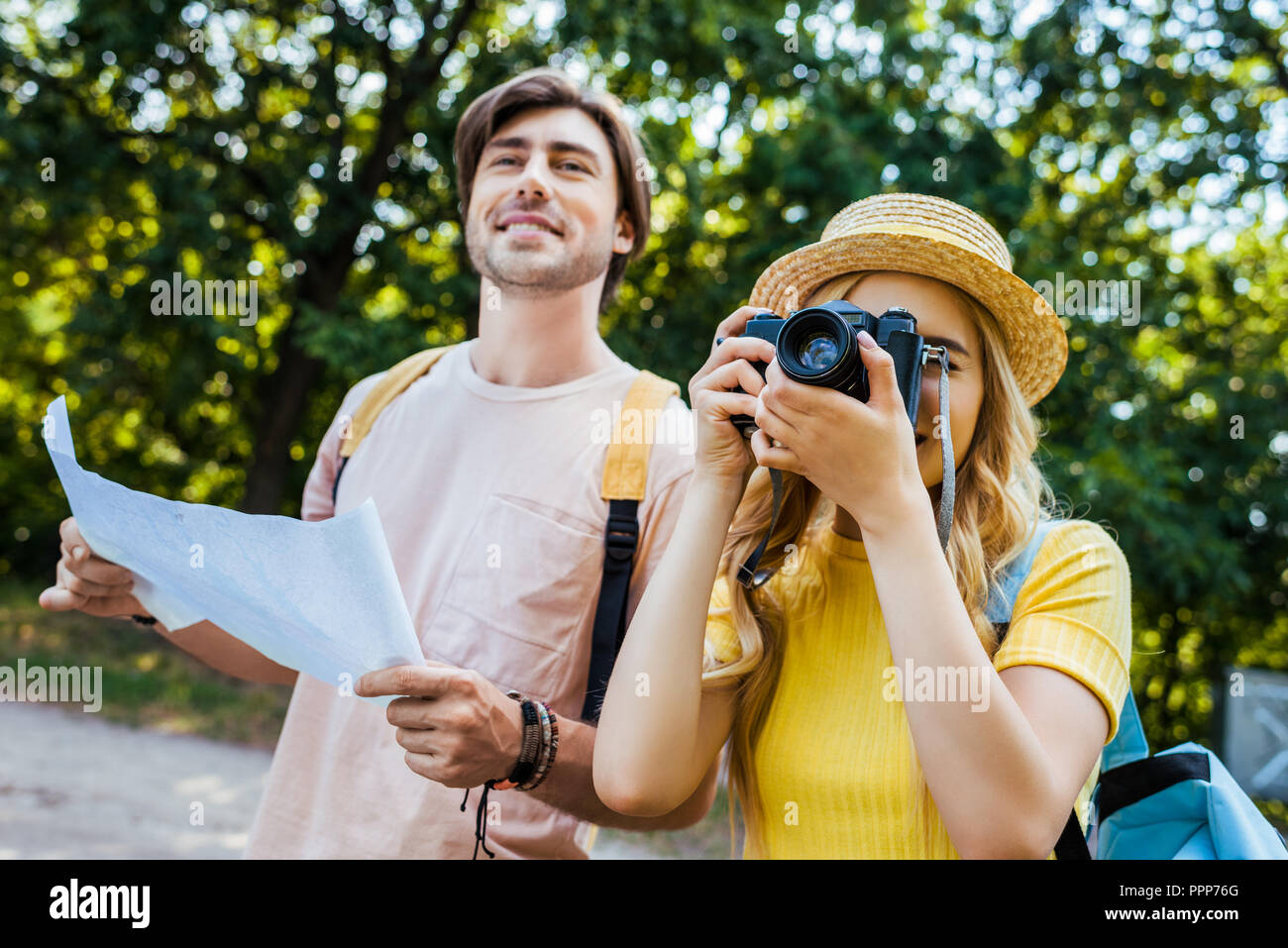 Tourists camera map hi-res stock photography and images - Alamy