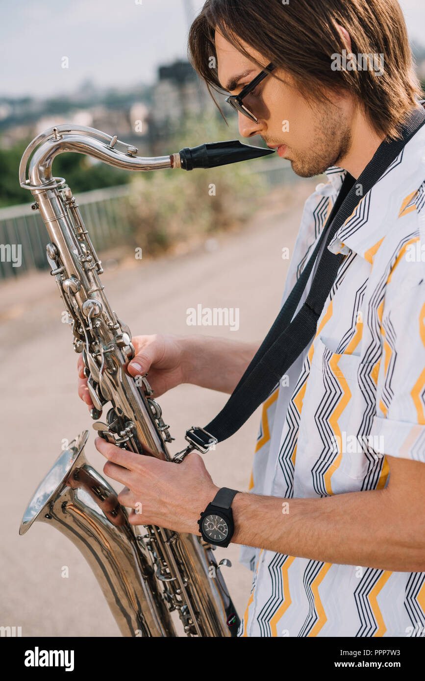 Man playing saxophone street concert hi-res stock photography and ...