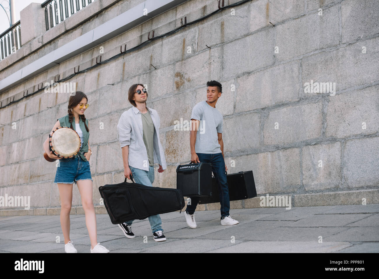 Musicians walking with instruments hi-res stock photography and images ...