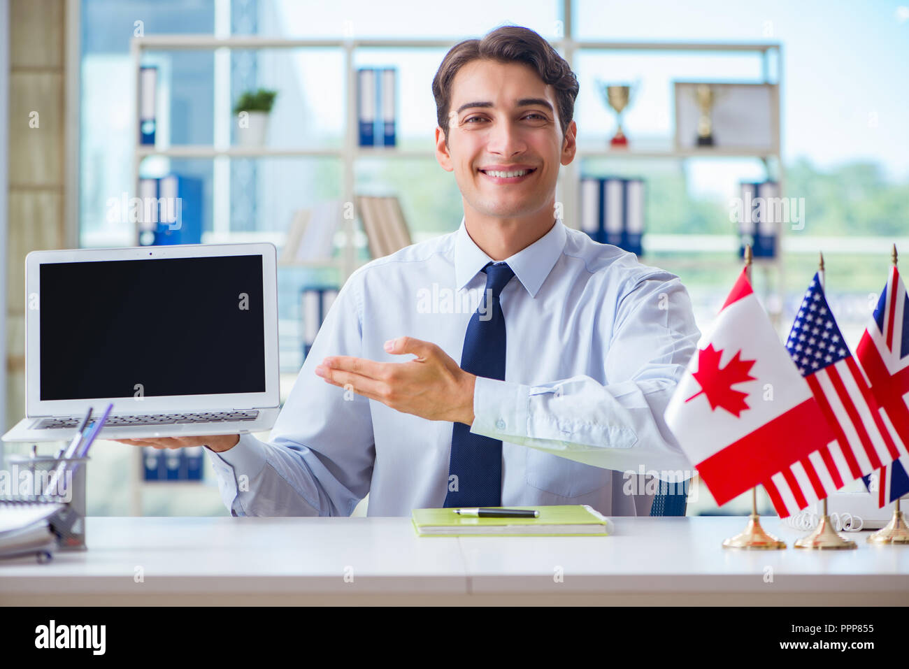 Sales agent working in travel agency Stock Photo - Alamy