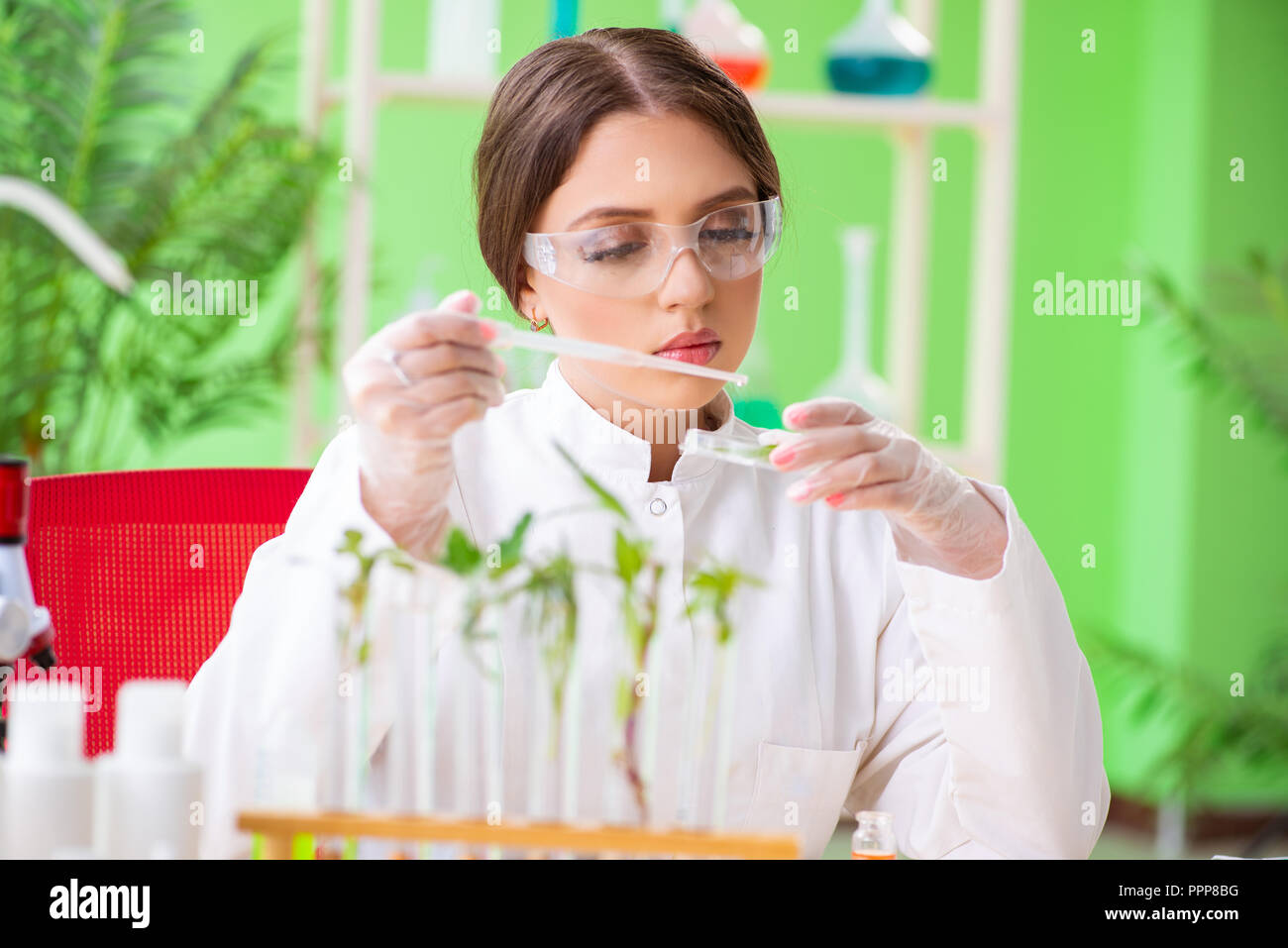 Beautiful female biotechnology scientist chemist working in lab Stock ...