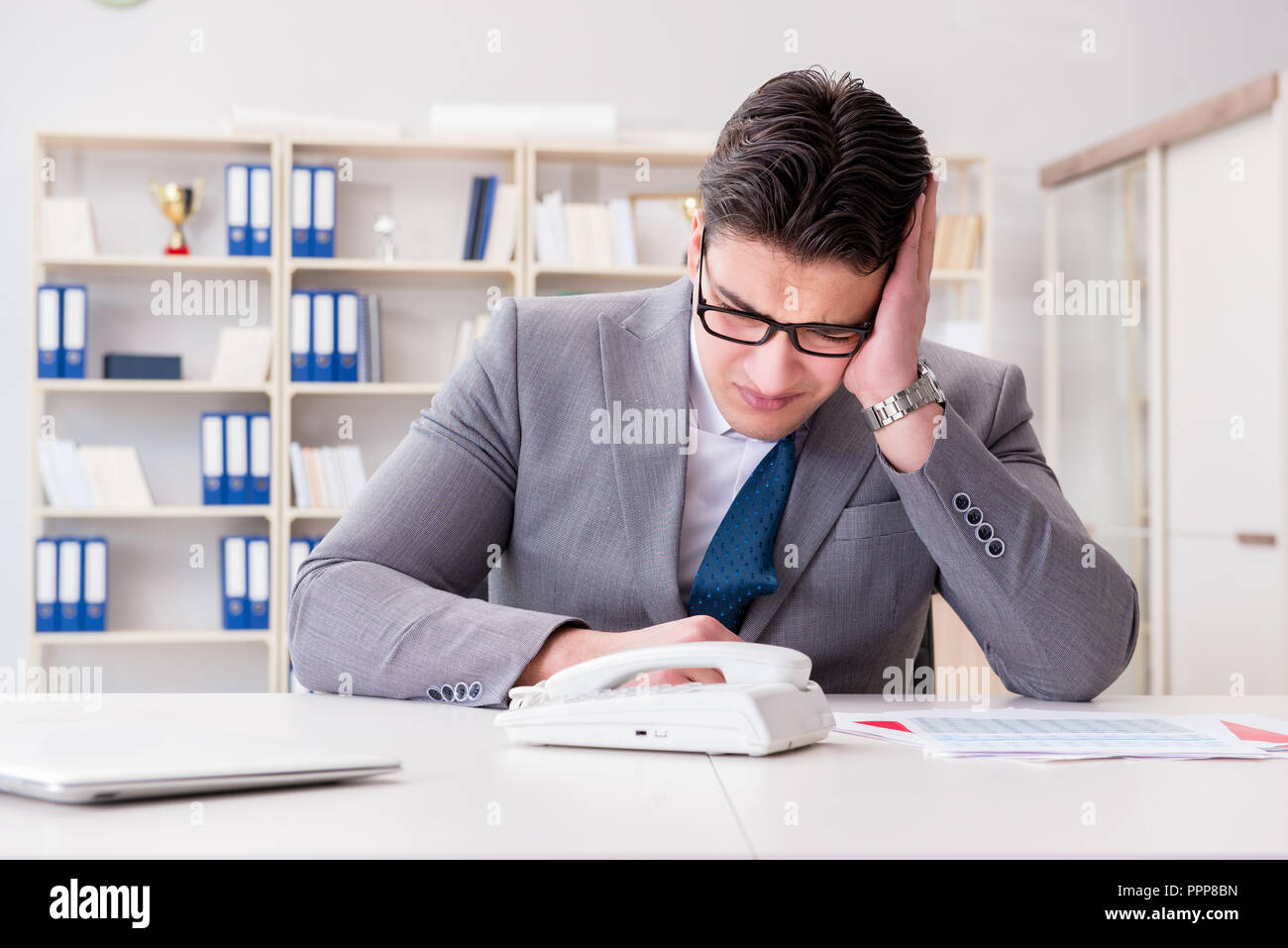 Businessman expecting important call on phone Stock Photo - Alamy