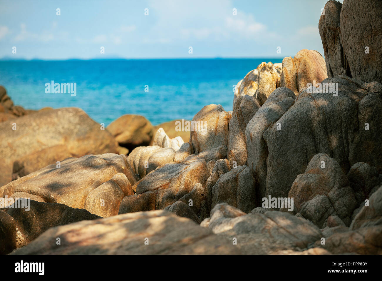 beautiful rock texture and blue sea harbor of tropical island of ...