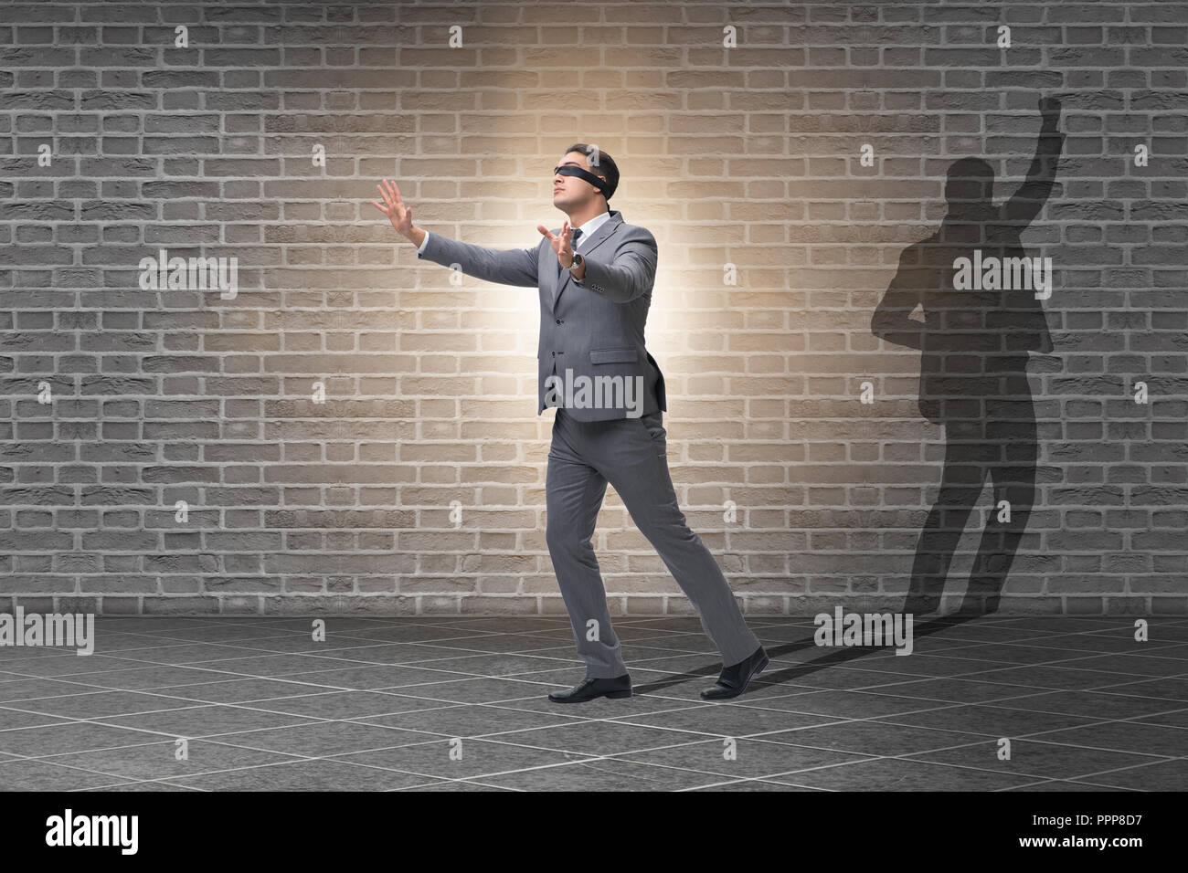 Businessman and his shadow in business concept Stock Photo - Alamy