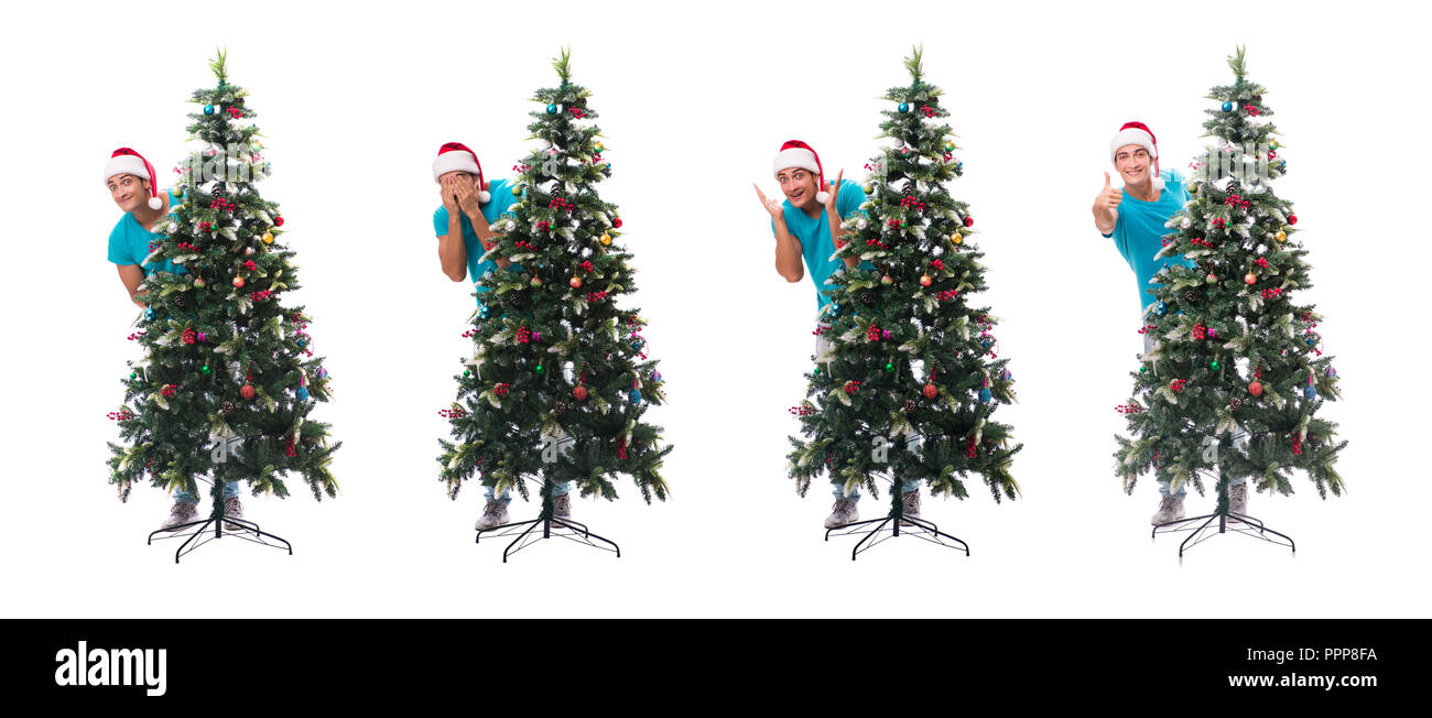 Young man decorating christmas tree isolated on white Stock Photo - Alamy