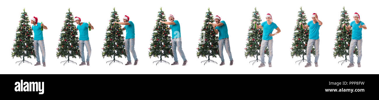 Young man decorating christmas tree isolated on white Stock Photo - Alamy