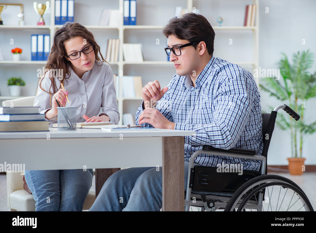 Disabled student studying and preparing for college exams Stock Photo ...