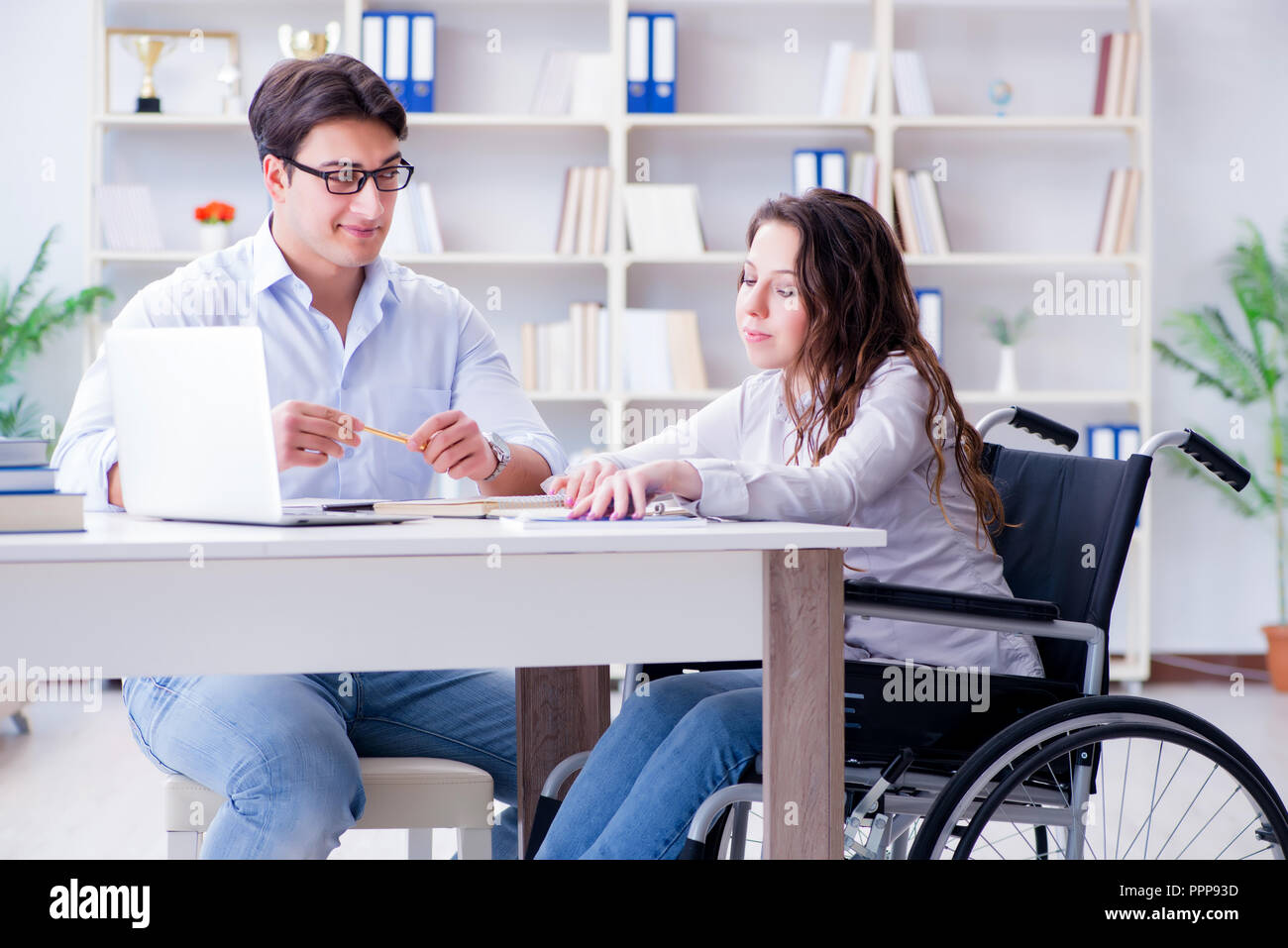 Disabled student studying and preparing for college exams Stock Photo ...