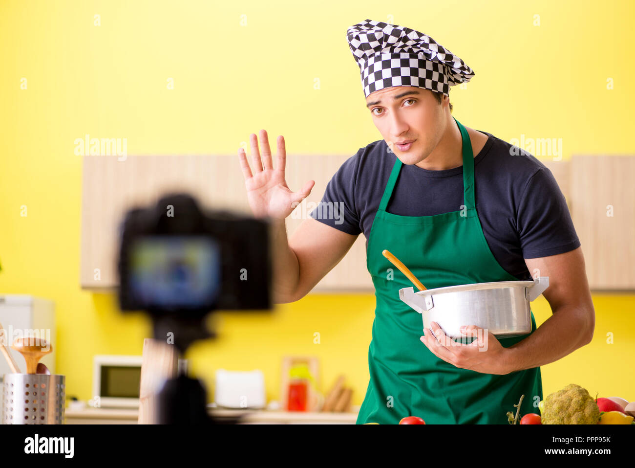 Young chef blogger explaining food preparation Stock Photo - Alamy