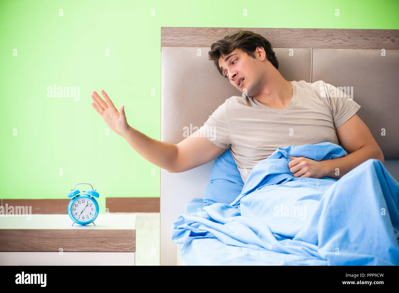 Man having trouble with his sleep Stock Photo - Alamy