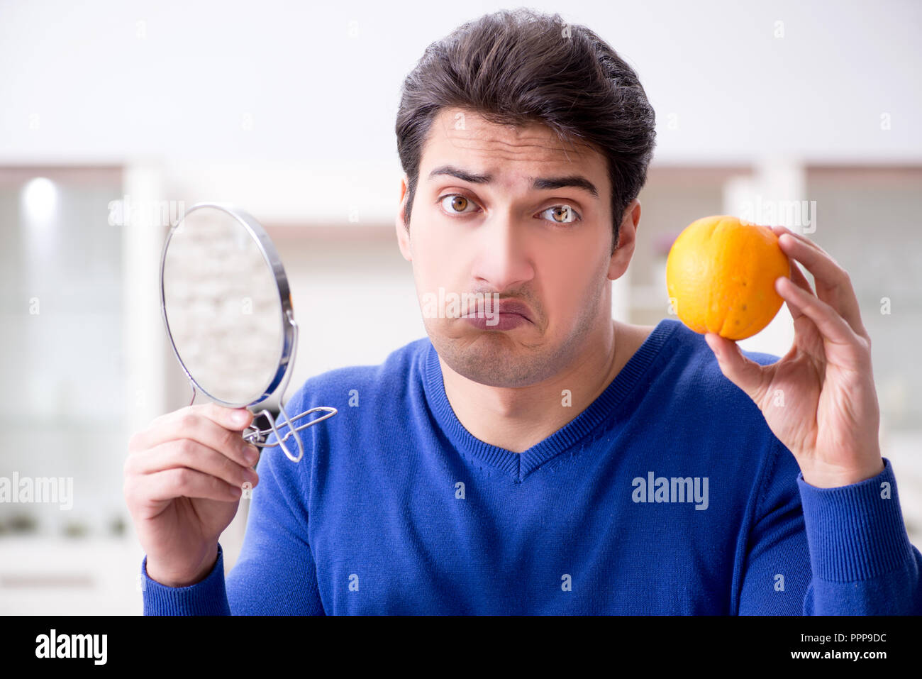 Young handsome man taking care of face skin Stock Photo - Alamy
