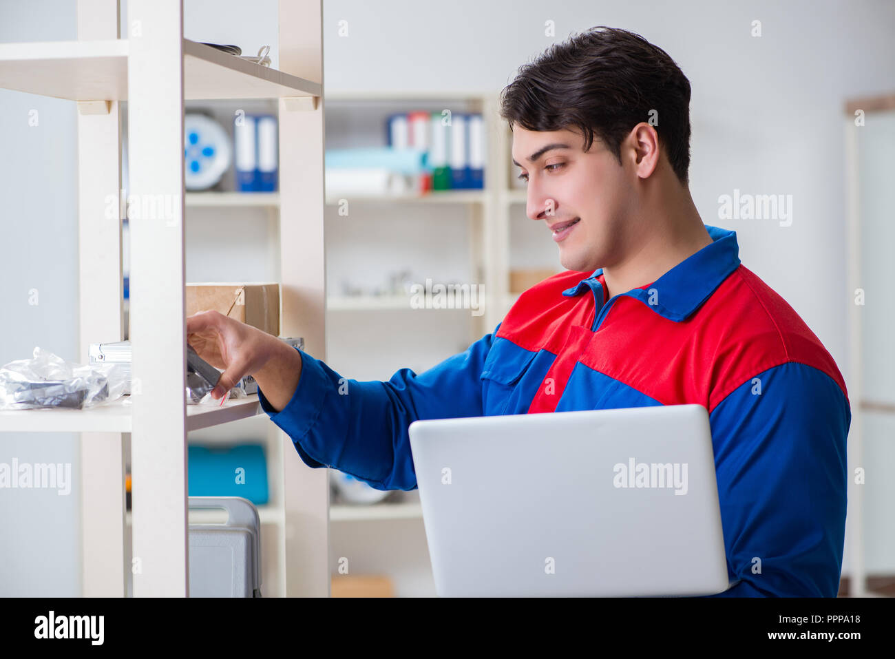 Man working in the postal warehouse Stock Photo - Alamy