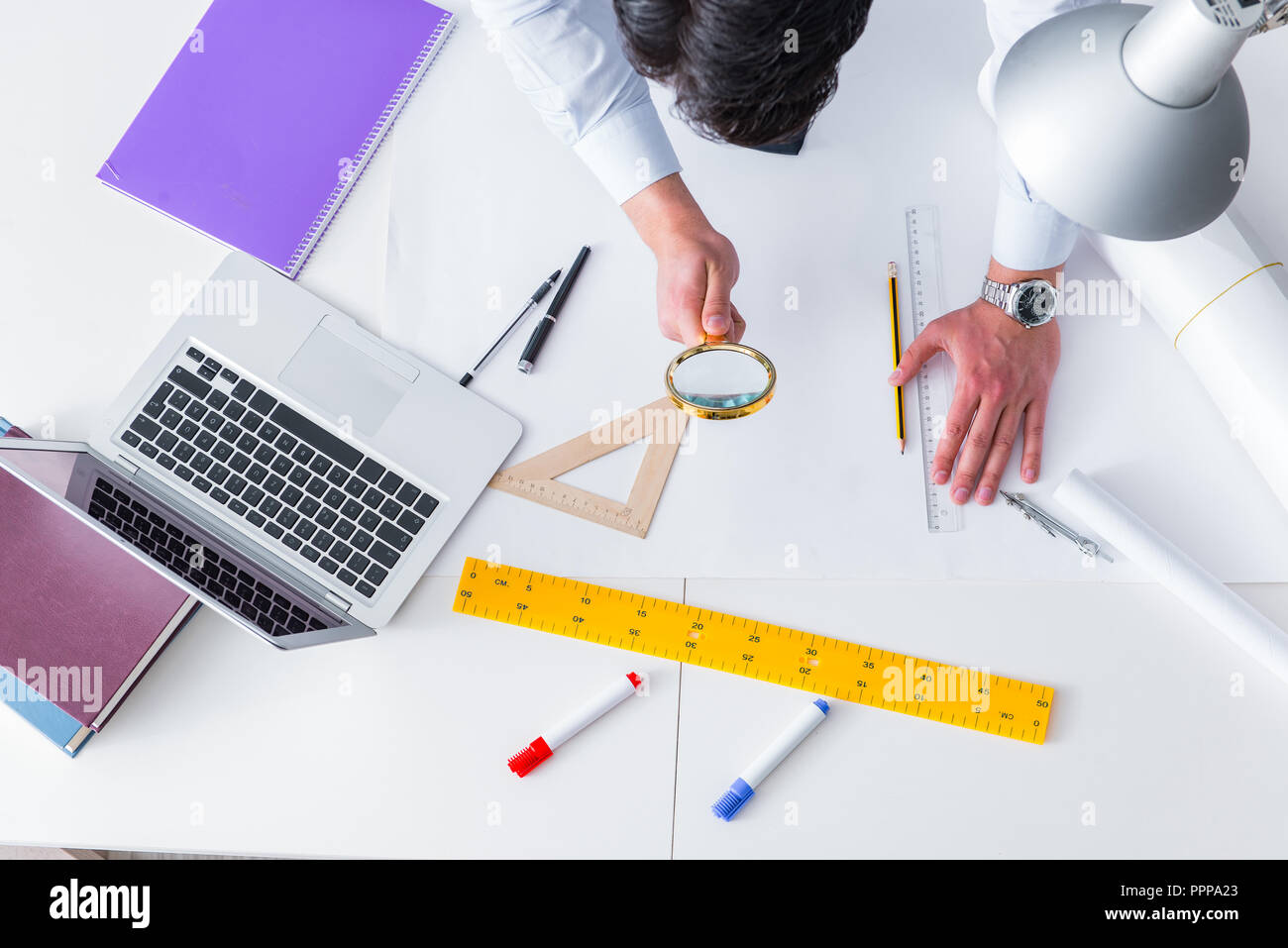 Engineer working on new project drawings Stock Photo - Alamy