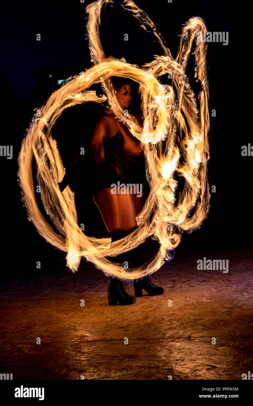 CANCUN, MEXICO - 07/29/2018. Lady juggler mesmerizes audience with her ...