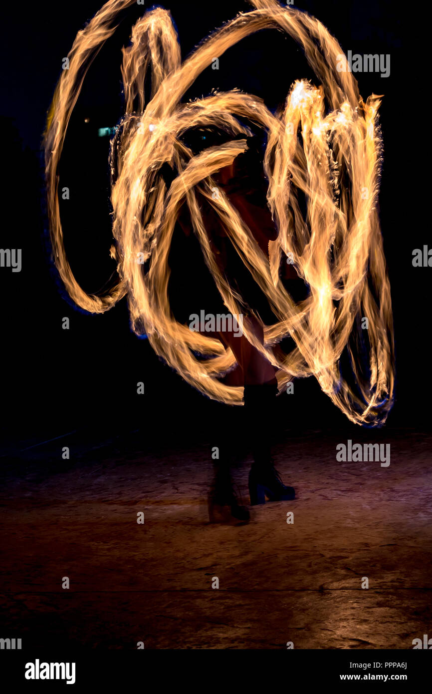 CANCUN, MEXICO - 07/29/2018. Lady juggler mesmerizes audience with her ...