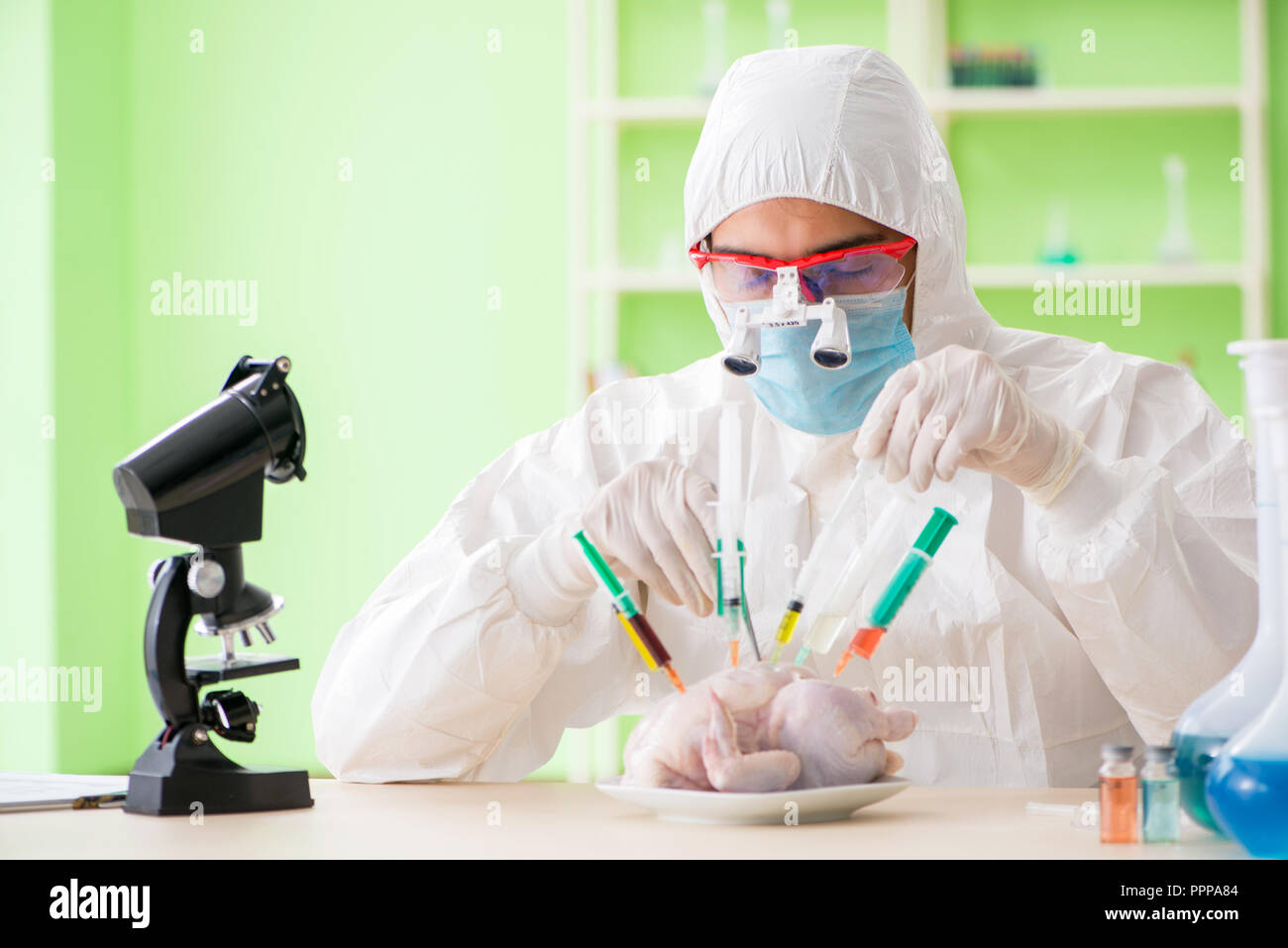 Lab assistant testing GMO chicken Stock Photo - Alamy