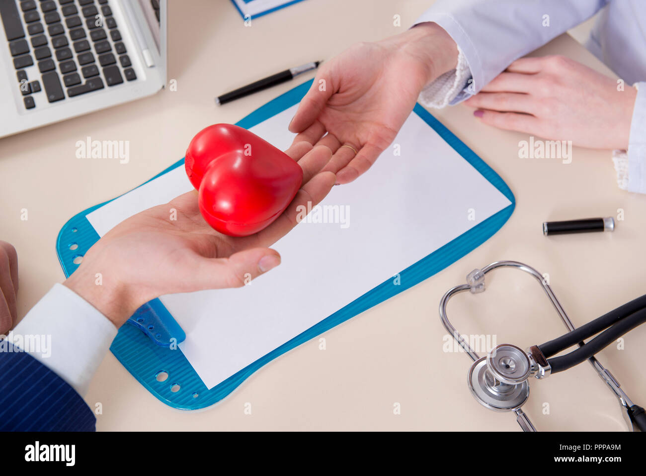 Businessman visiting cardiologist for routine check-up Stock Photo - Alamy