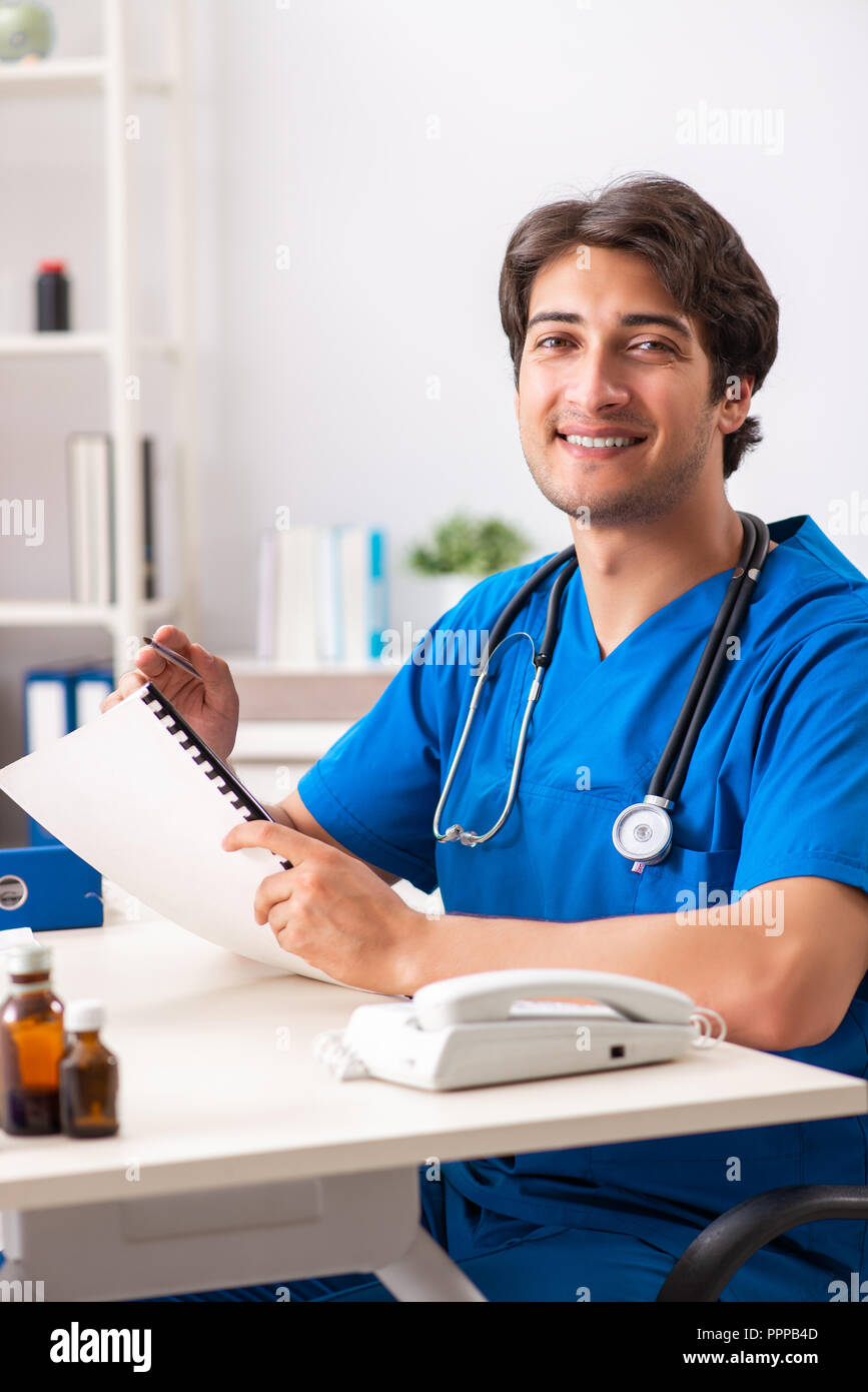 Young doctor working in the hospital Stock Photo - Alamy