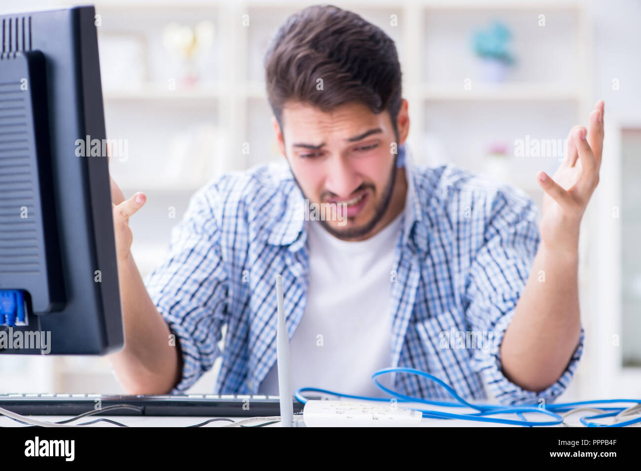 Frustrated young man due to weak internet reception Stock Photo - Alamy