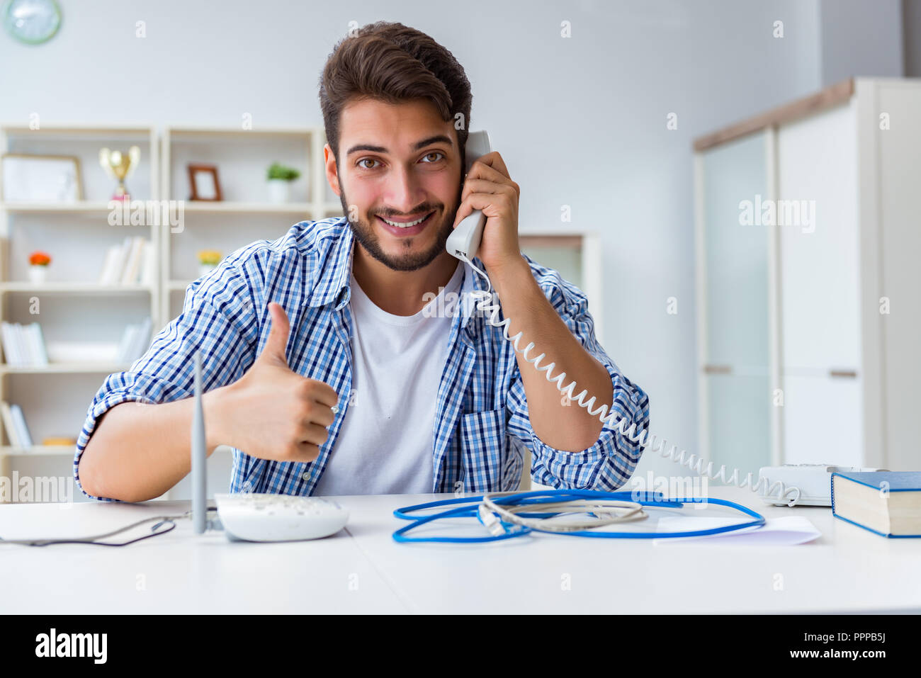 Man enjoying fast internet connection Stock Photo - Alamy