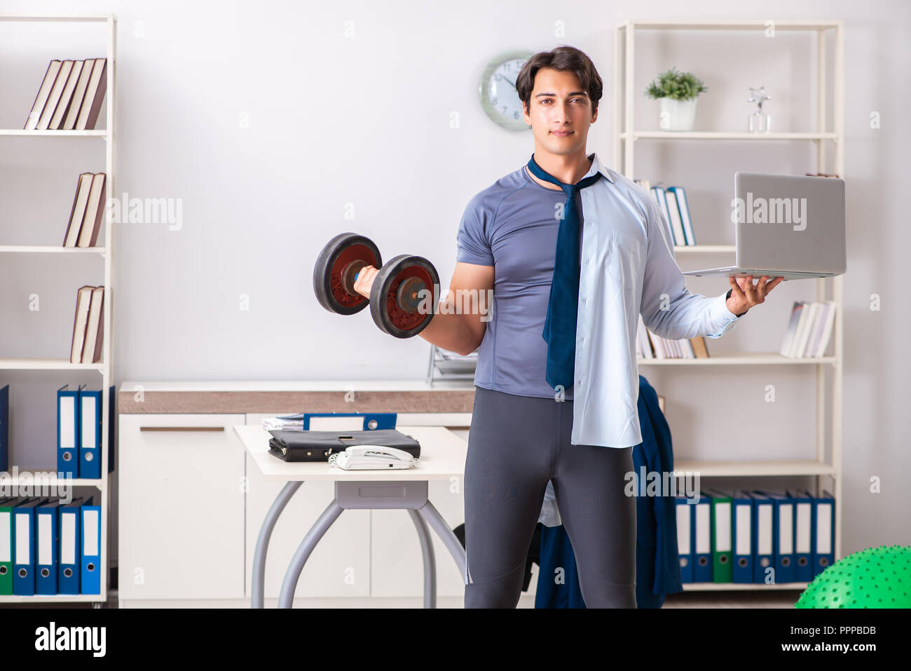 Employee combining work and healthy lifestyle Stock Photo - Alamy