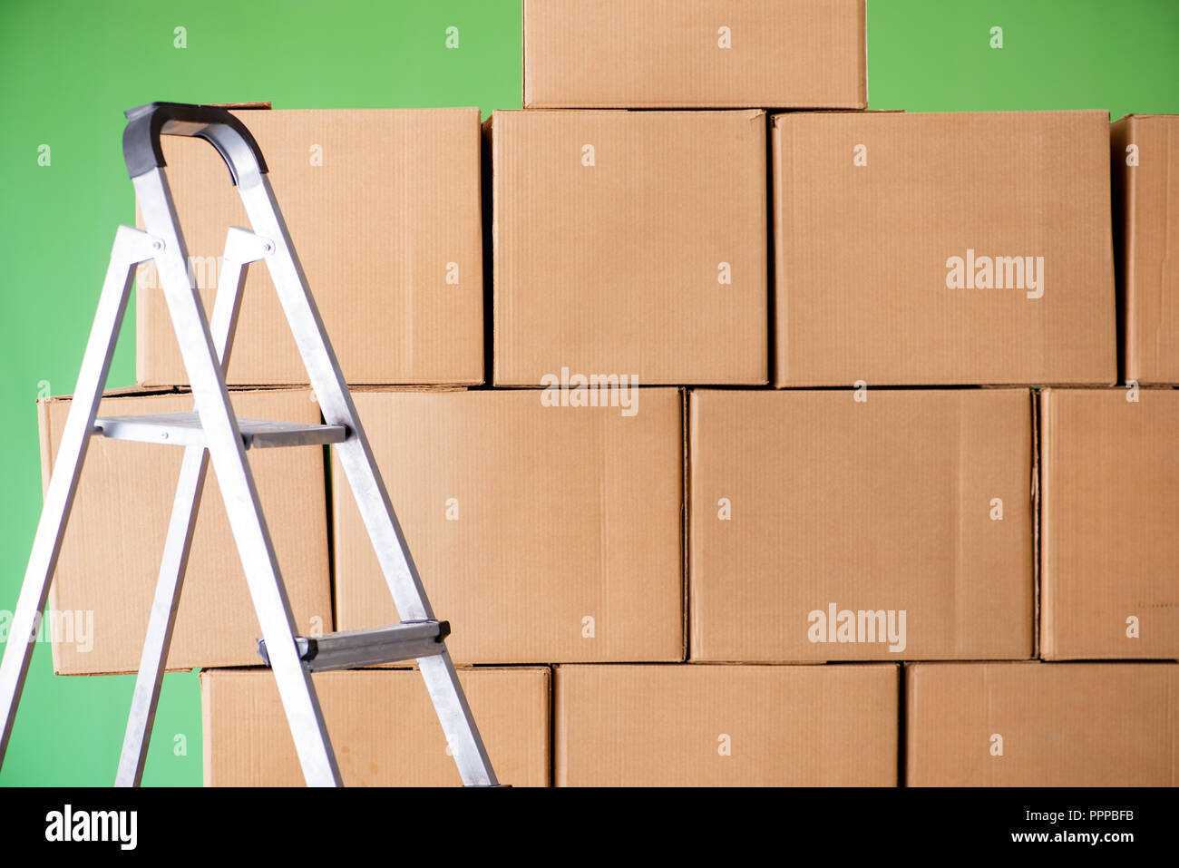 Many boxes and ladder in depot Stock Photo - Alamy