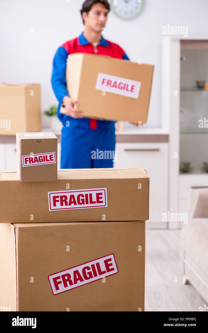 Transportation contractor with fragile boxes Stock Photo - Alamy
