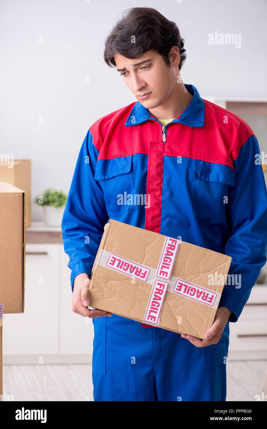 Transportation contractor with fragile boxes Stock Photo - Alamy