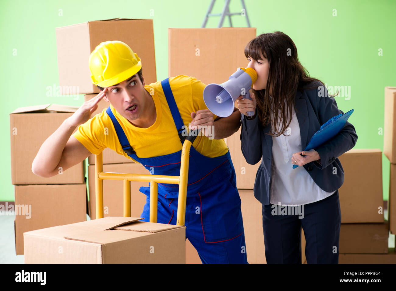 Woman boss and man contractor working with boxes delivery Stock Photo ...