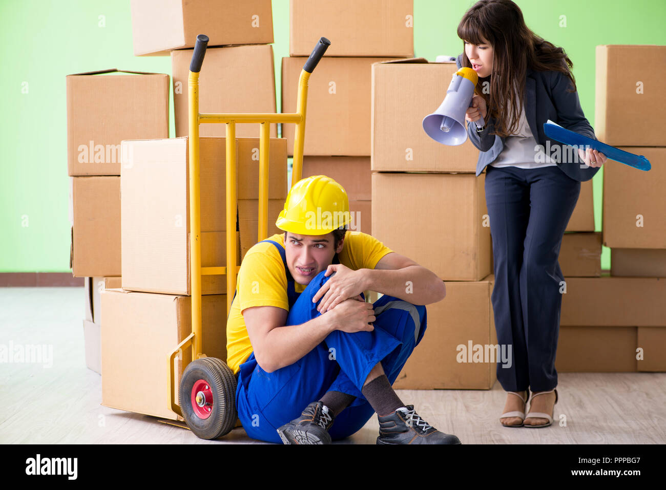 Woman boss and man contractor working with boxes delivery Stock Photo ...